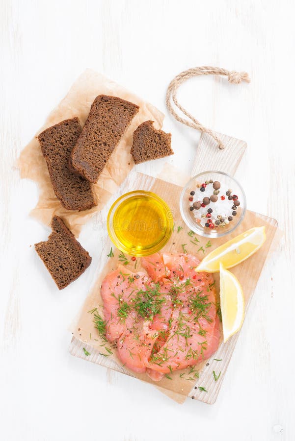 Salted Salmon, Bread and Ingredients on a Wooden Board, Top View Stock ...