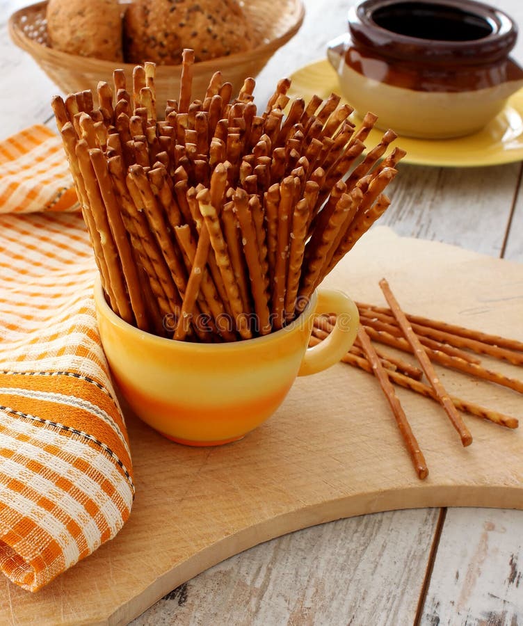 Salted Sticks in Yellow Cup on Wooden Stock Photo - Image of pretzels ...