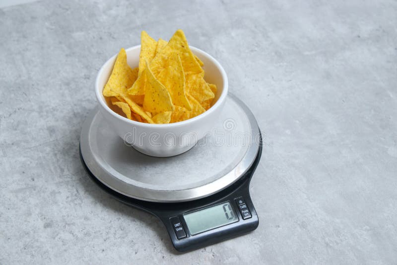 Salted Tortilla Nacho Chips in a White Bowl on a Kitchen Scale, Grey ...