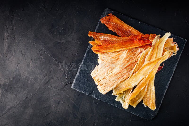 Salty Dried Fish Snacks for Beer on a Dark Background Stock Photo ...