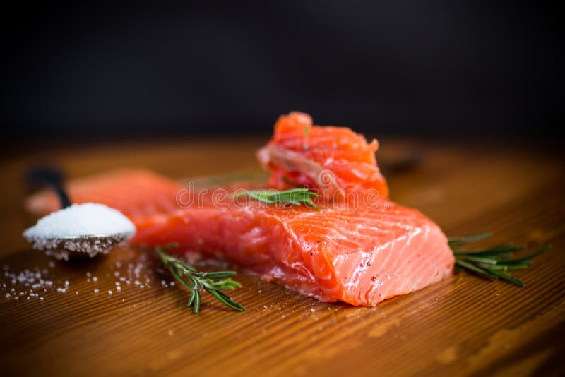Salty Red Fish on a Fork, Wooden Background Stock Image - Image of ...