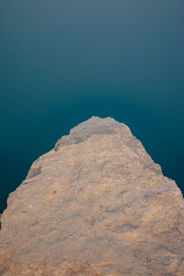 Salty rock with blue ocean stock image. Image of blue - 217452509
