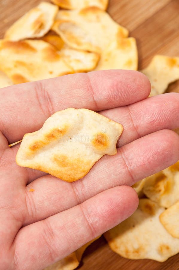 Salty snacks in hand stock photo. Image of hand, wheat - 53768934