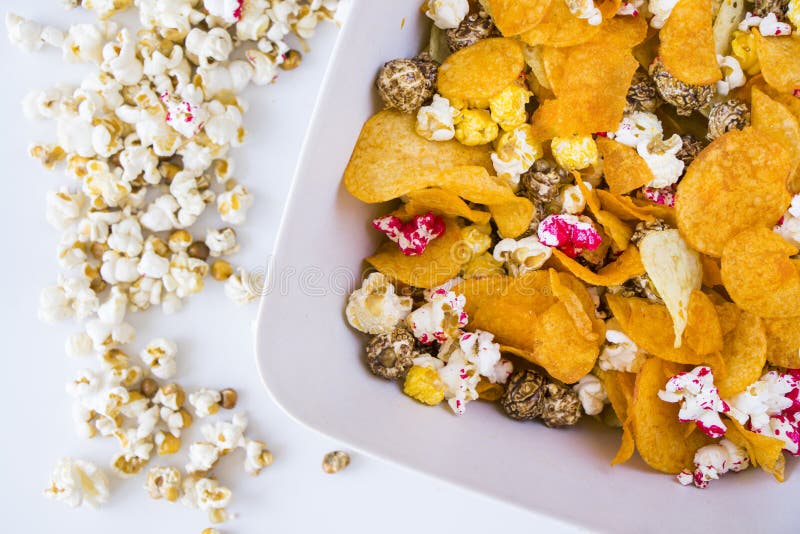 Salty and Sweet Popcorn and Chips on the White Background Stock Image ...
