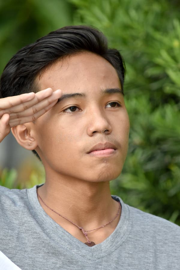 Saluting Good Looking Boy stock photo. Image of viewing - 142561334