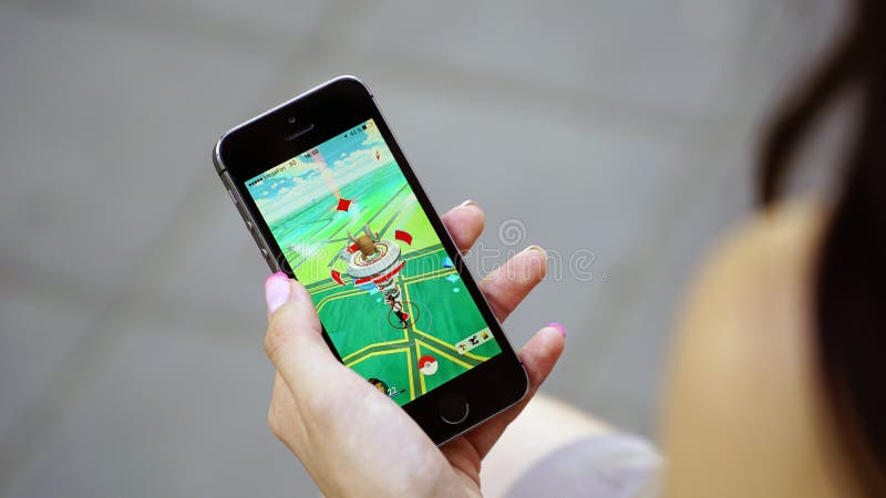 Samara, Russia - August 6, 2016: Woman Playing Pokemon Go on His Iphone ...