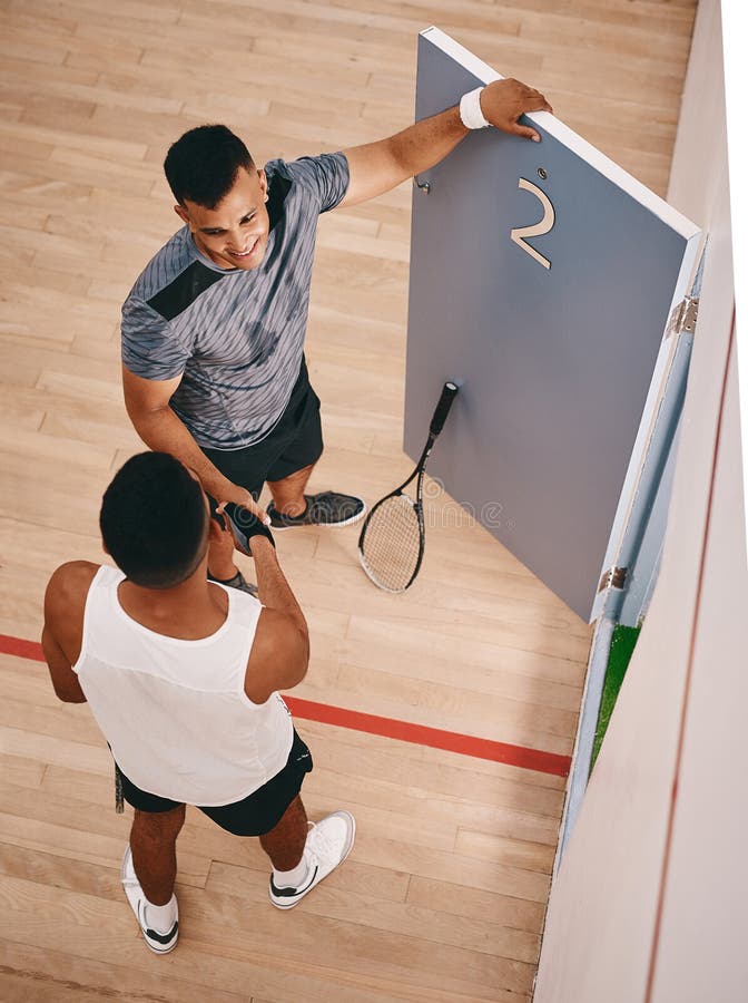 Same Time Next Weekend. High Angle Shot of Two Young Men Shaking Hands ...