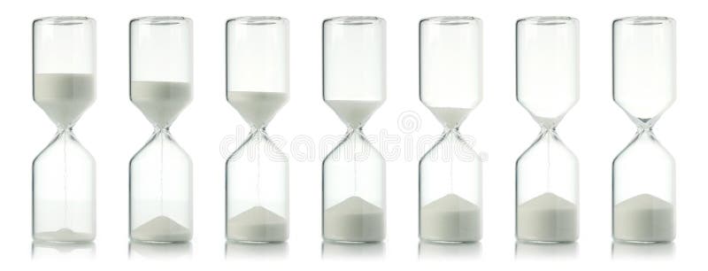 Samling Av Timglas Med Vit Sand Arkivfoto - Bild av flöda, klocka ...