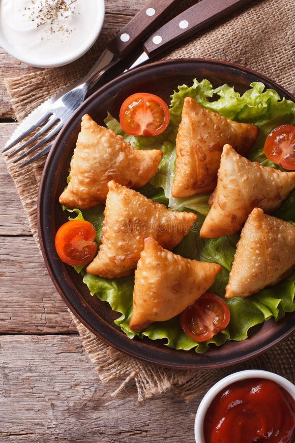 Samosa On A Plate With Sauce Closeup, Vertical Top View Stock Photo ...