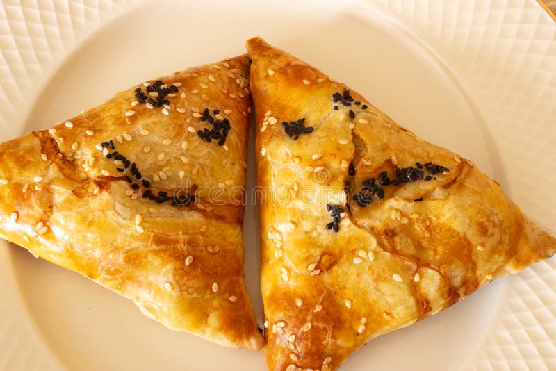 Samosa on a White Plate. Yellow Samosa on a White Plate. Yellow Samos ...