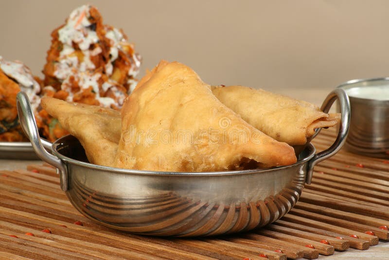 Samosas in a metal dish stock photo. Image of appetizer - 29348656