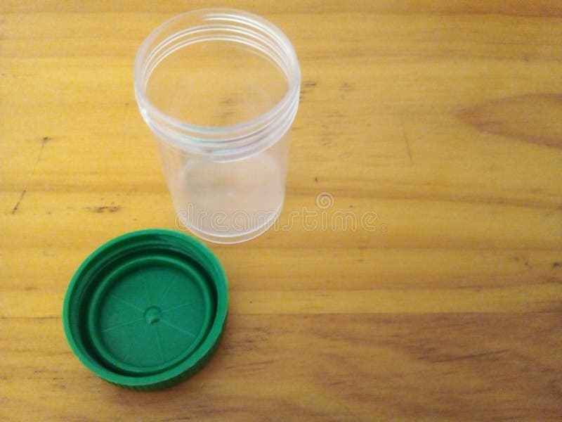 A Sample Cup on a Wooden Table Stock Image - Image of equipment ...