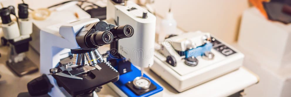 A Sample Preparation Table in a Laboratory with an Optical Microscope ...