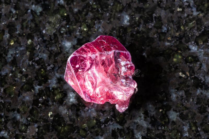 Sample of Raw Red Spinel Crystal on Black Granite Stock Photo - Image ...