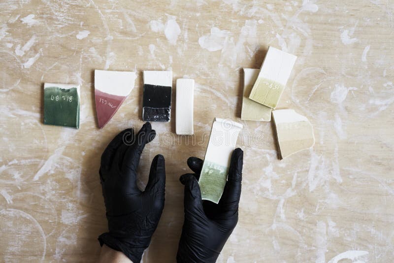 Samples of Colored Enamel for Color Ceramic in Hands, Working Process ...