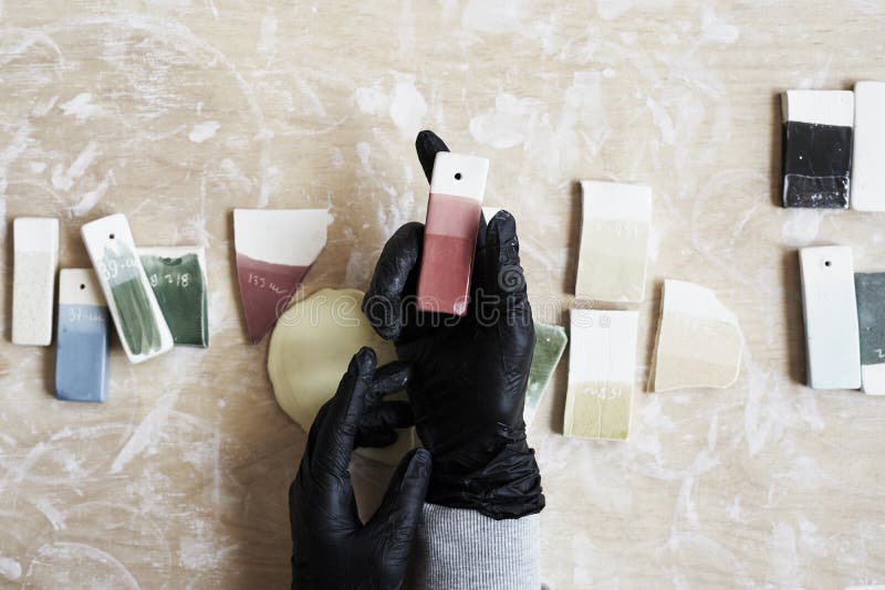 Samples of Colored Enamel for Color Ceramic in Hands, Working Process ...