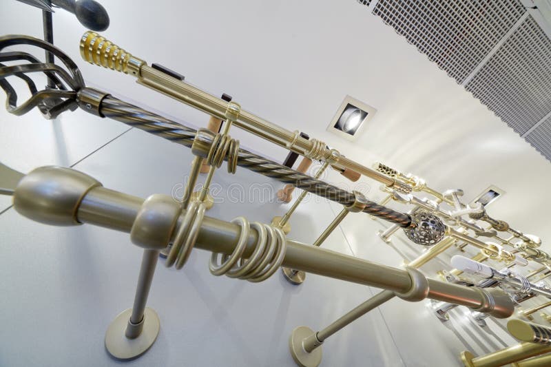 Samples of Curtain Poles on Wall in Retail Stock Photo - Image of ...