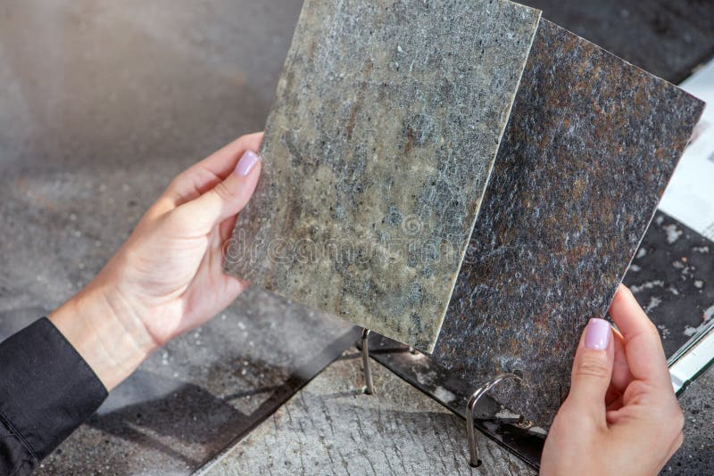 Samples of Decorative Stone. a Woman Designer Holds in Her Hands ...