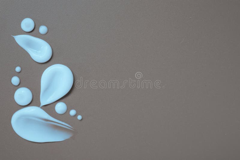 Samples of Light Blue Face Cream on Grey Background, Flat Lay. Space ...