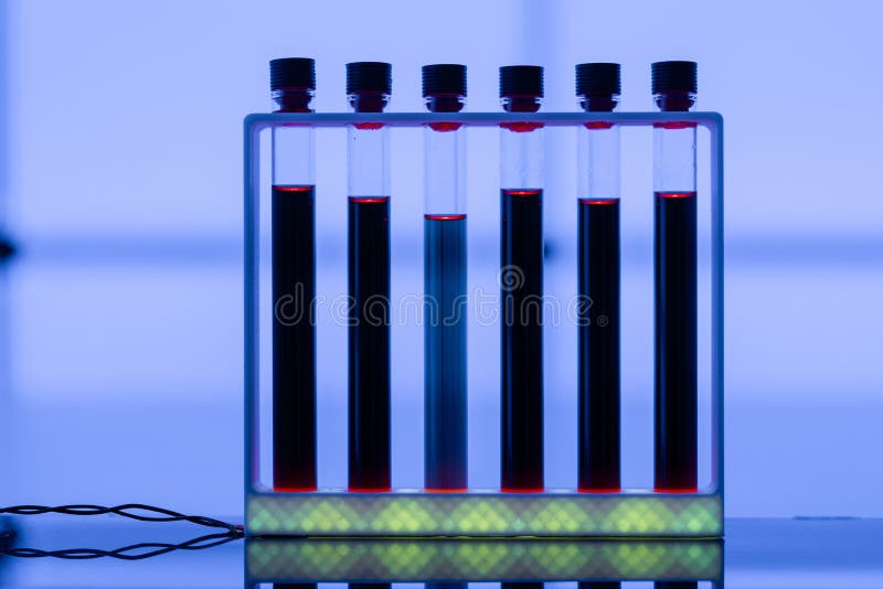 Samples of Radioactive Liquid in Test Tubes in a Nuclear Physics ...
