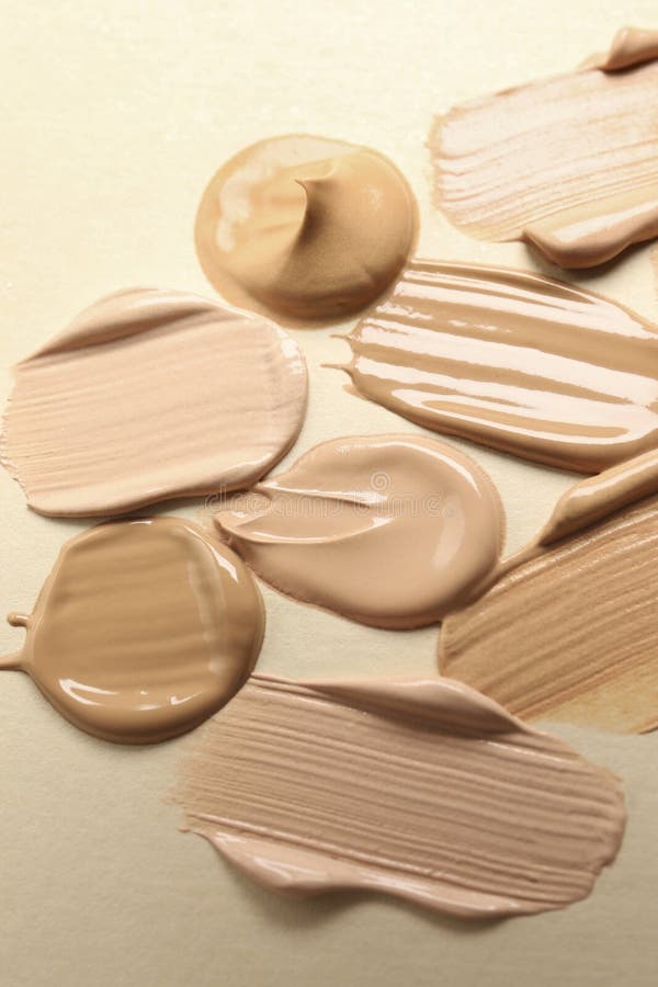 Samples of Skin Foundation on Beige Background, Closeup Stock Photo ...