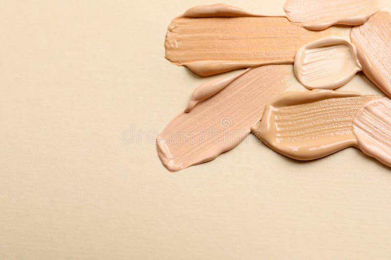 Samples of Skin Foundation on Beige Background, Closeup. Space for Text ...