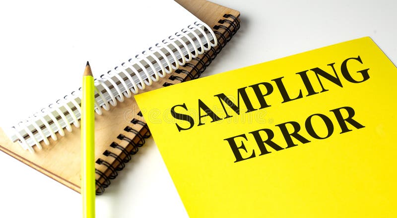 Sampling Error Text on a Yellow Paper Alongside Notebooks and a Yellow ...