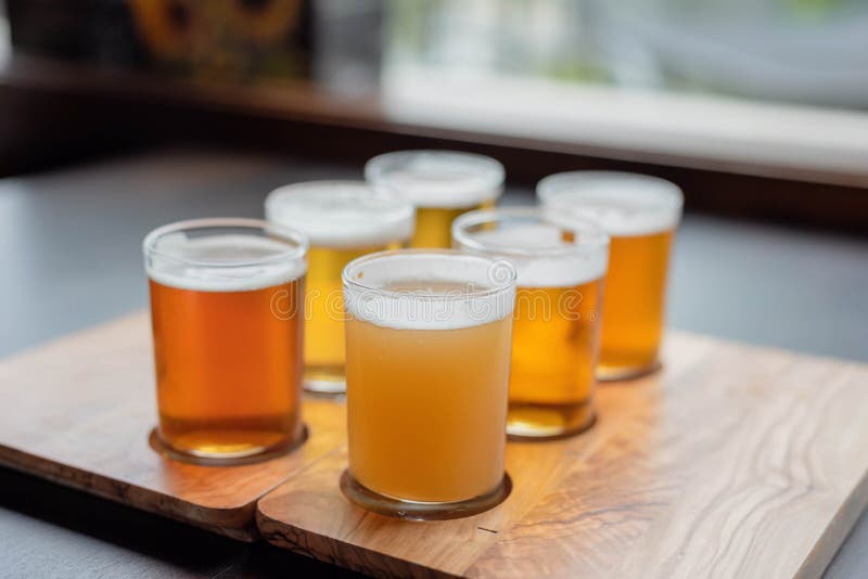 Sampling Variety of Beers from a Beer Flight Stock Image - Image of ...