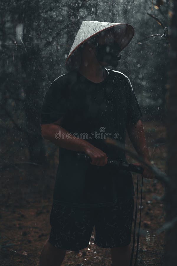 Samurai with Katana in the Forest in the Rain in the Sun. a Samurai ...