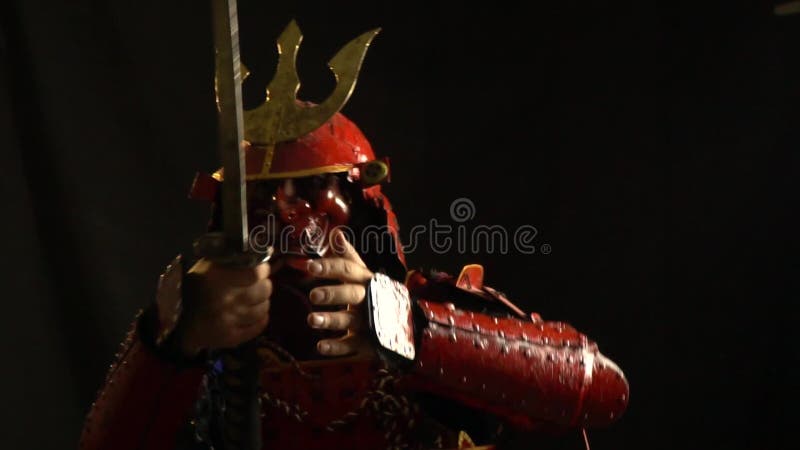 Samurai in a Red Armor and Helmet Demon Mask Becomes a Defensive Pose ...
