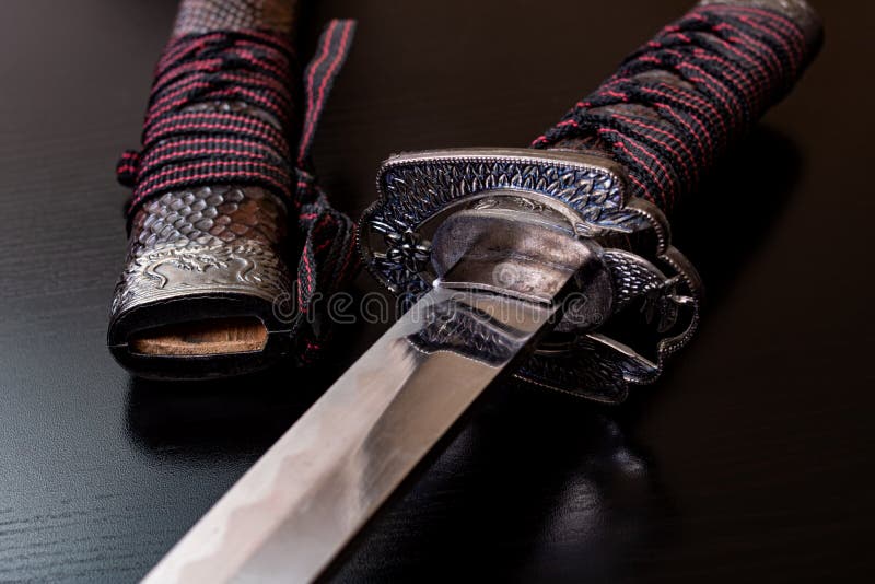 Samurai Sword on a Black Wooden Table Stock Photo - Image of antique ...