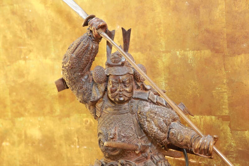 Samurai Warrior Statue Isolated on Gold Background Editorial ...