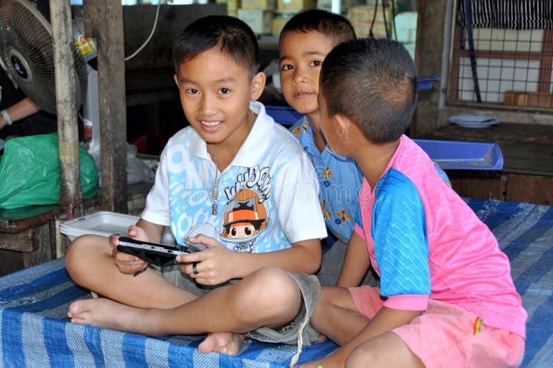Samut Songkhram, Thailand: Boys with PSP Editorial Stock Photo - Image ...