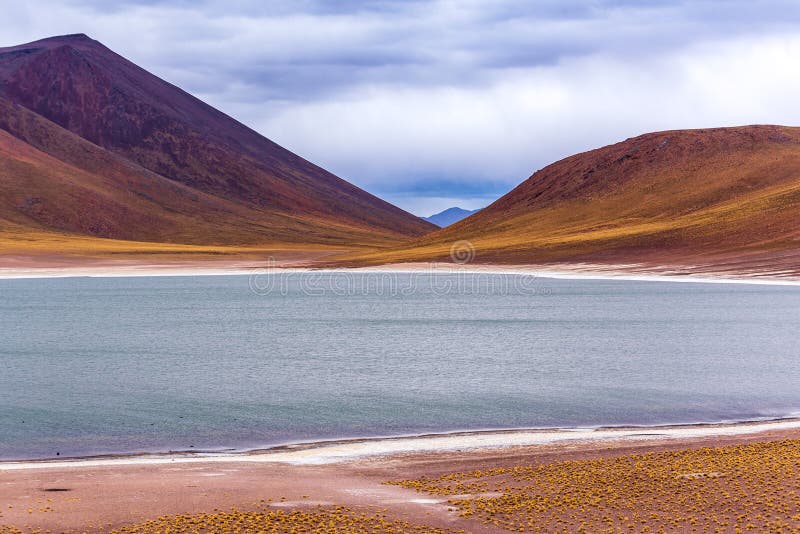 Valley with Lagoon and Volcanic Mountains in Atacama Desert Stock Photo ...