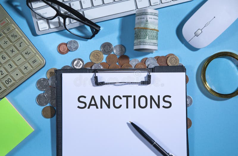 Sanctions on Clipboard with a Money and Business Objects Stock Image ...