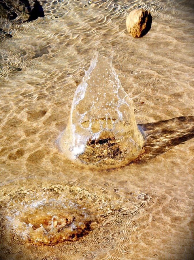 Sand Ball Goes Splash stock photo. Image of sand, ball - 96945174