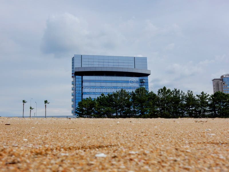 Sand Beach with Glass Building Aganst Sky Stock Image - Image of aganst ...