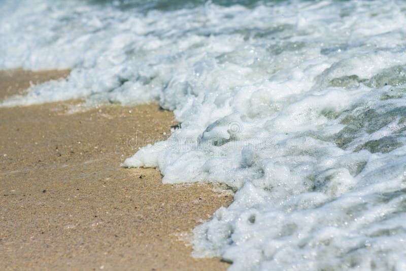 Sand beach and sea foam stock image. Image of liquid - 105958465
