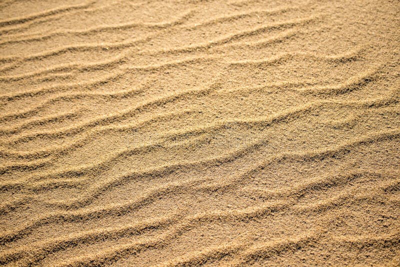 Sand of a Beach with Wave Patterns Stock Image - Image of surface ...