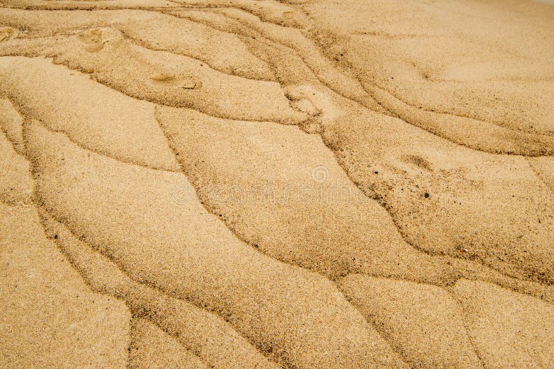 Sand of a Beach with Wave Patterns Stock Photo - Image of wide, surface ...