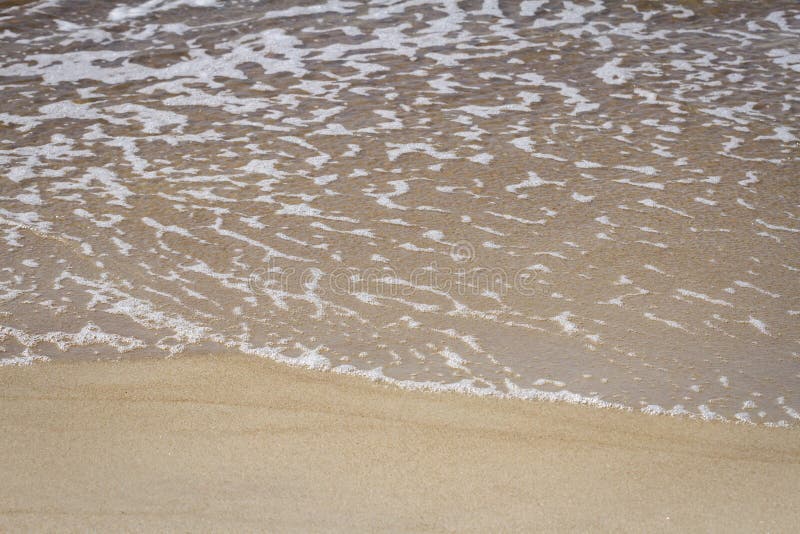 Sand beach and waves stock photo. Image of seashore - 252327312