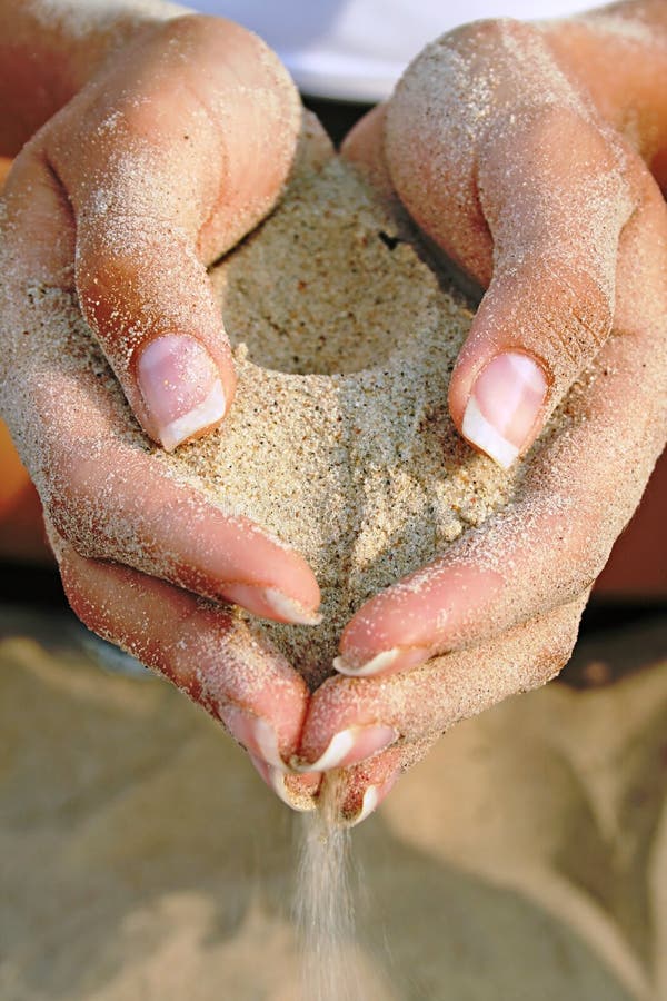 Sand in beautiful hands stock photo. Image of sand, beach - 3913742