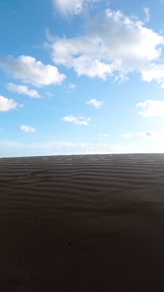 Sand in a Blue Sky with a Cloud Stock Photo - Image of sand, cloud ...
