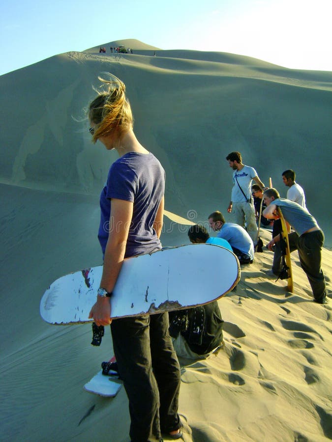 Sand boarding down dunes editorial photo. Image of death - 62056996