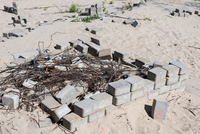 Sand, Bricks and Branches on the Beach. Fire Place Stock Image - Image ...
