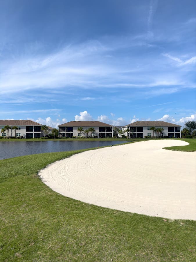 Sand bunker stock photo. Image of florida, houses, pond - 262619200