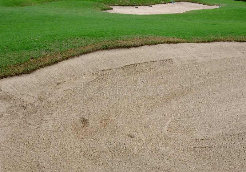 Sand bunker in golf course stock photo. Image of countryside - 57374422
