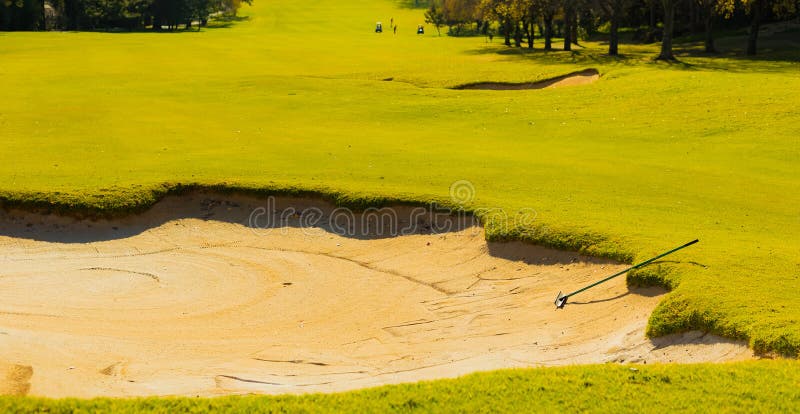 Sand Bunker Hazard and Rake on Golf Course Fairway Stock Photo - Image ...