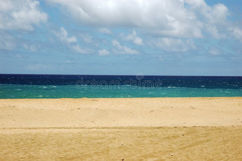 The Sand and Calm Waters of a Hawaiian Beach Stock Photo - Image of ...