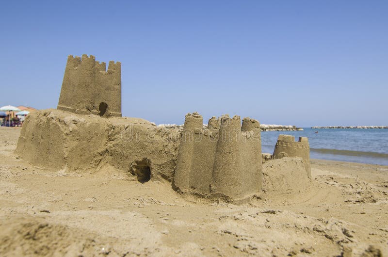 Sand castle on the beach stock image. Image of sand - 149557861